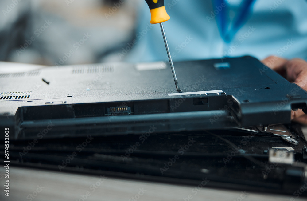 Laptop, technician and fixing with screwdriver, technology maintenance ...