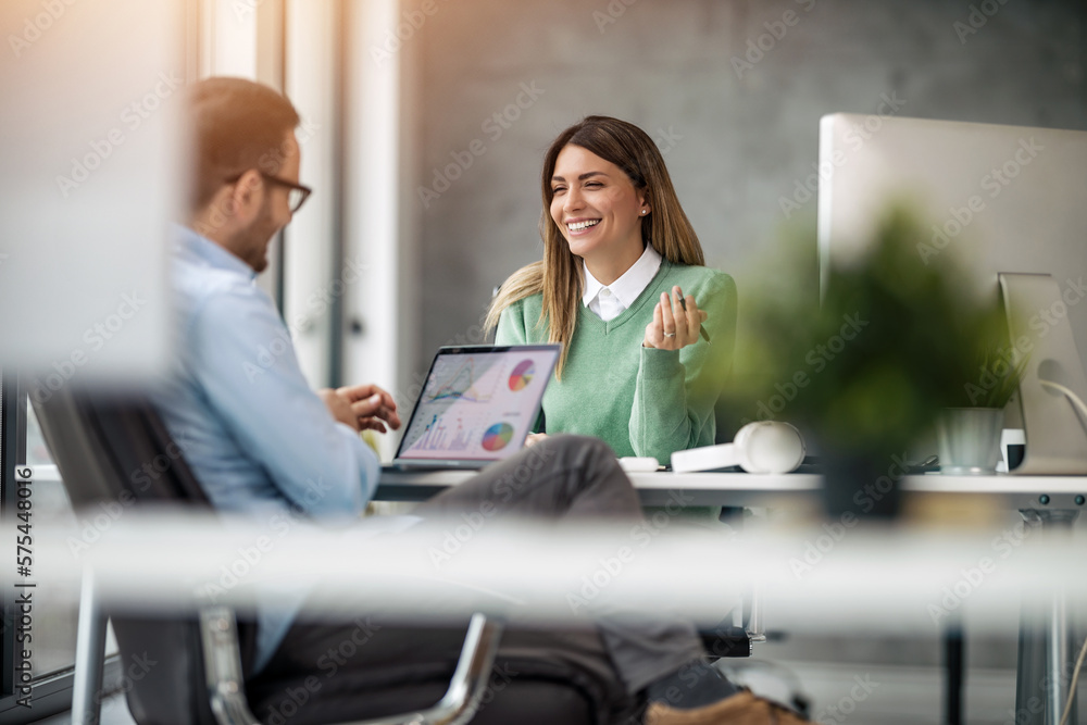 Smiling businessman taking interview of a female job applicant Stock ...