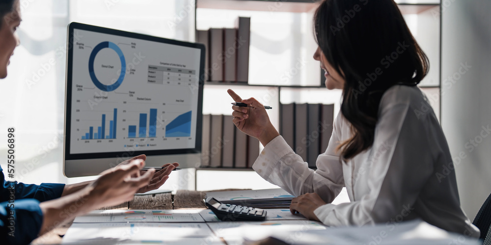 Two business people talk project strategy at office meeting room ...