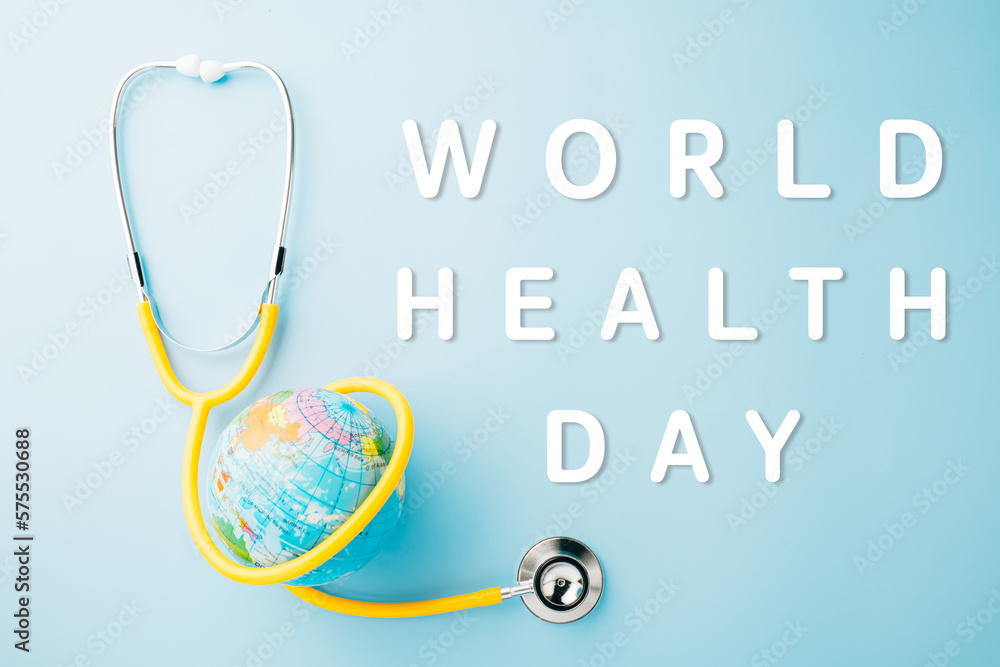 World Health Day. Top view yellow doctor stethoscope wrapped around ...