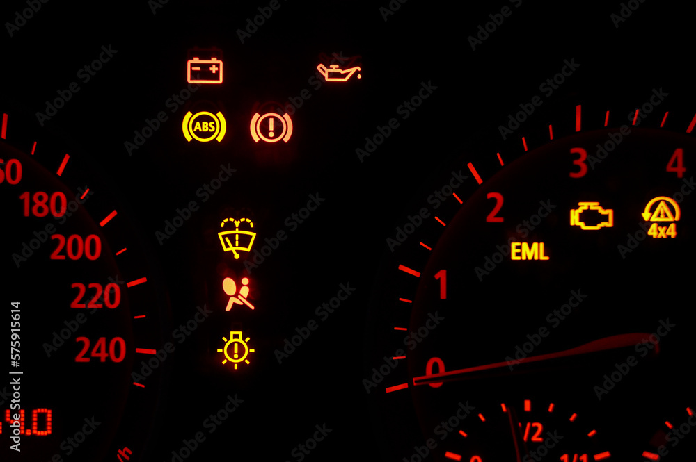 Dashboard lights in car. Orange and yellow warning lights in vehicle ...