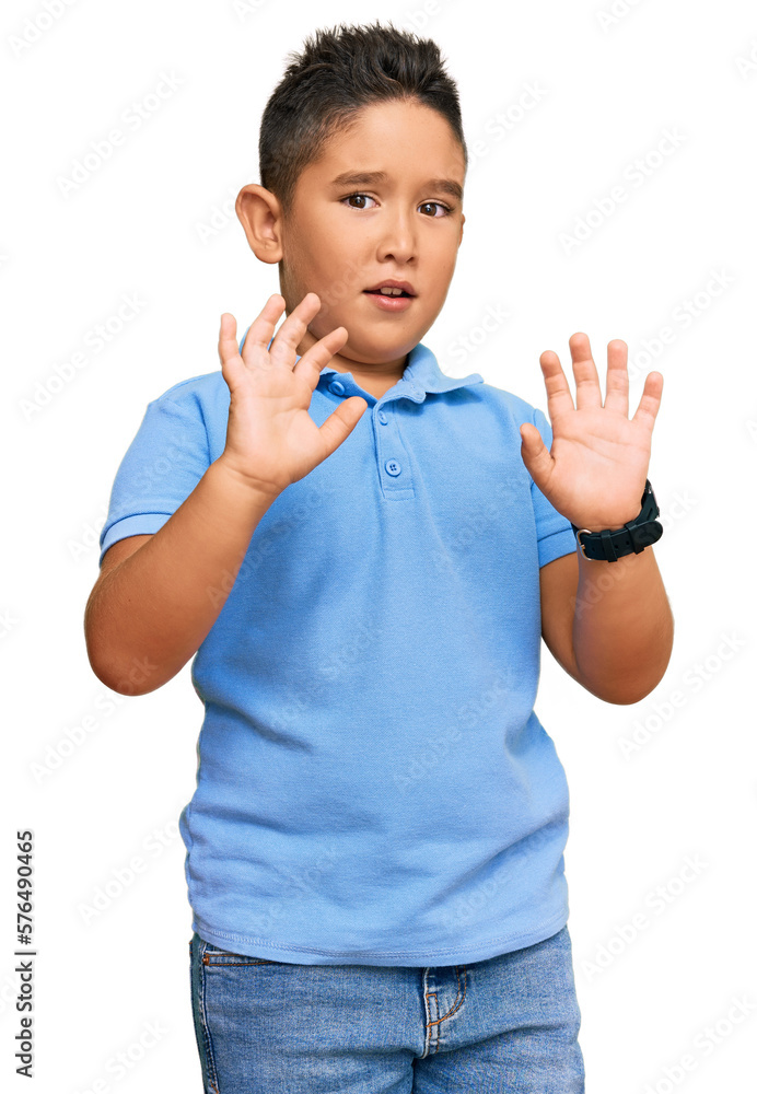 Little boy hispanic kid wearing casual clothes afraid and terrified ...