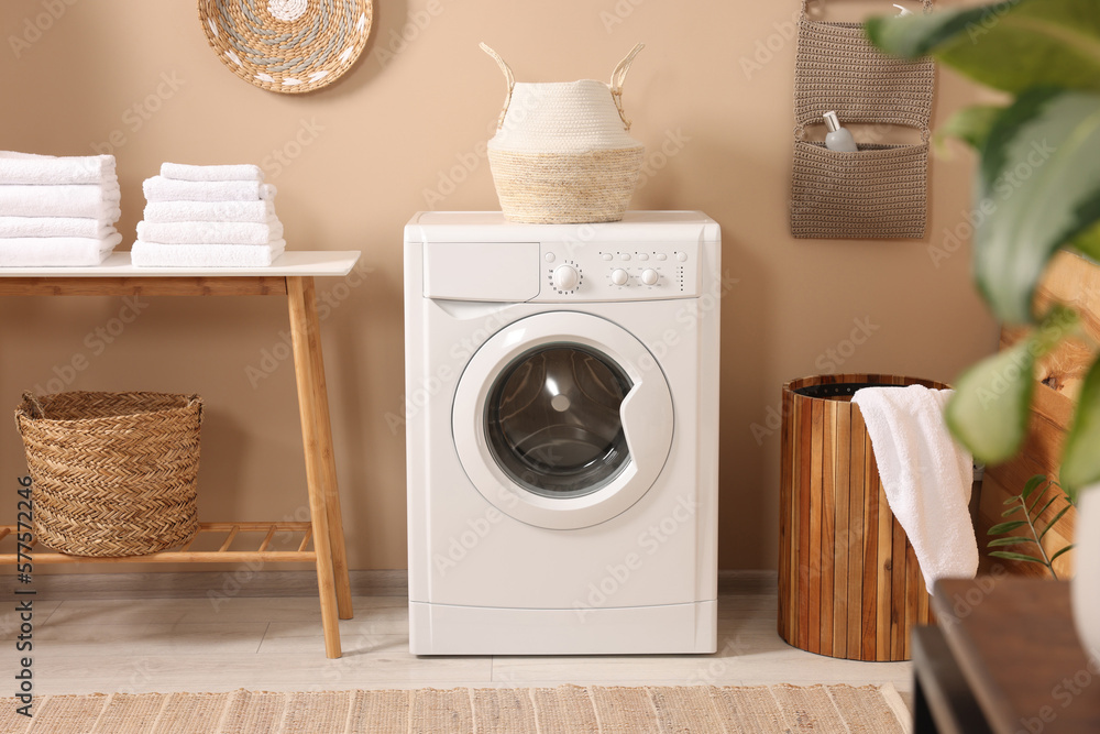 Stylish laundry room with modern washing machine. Interior design Stock ...