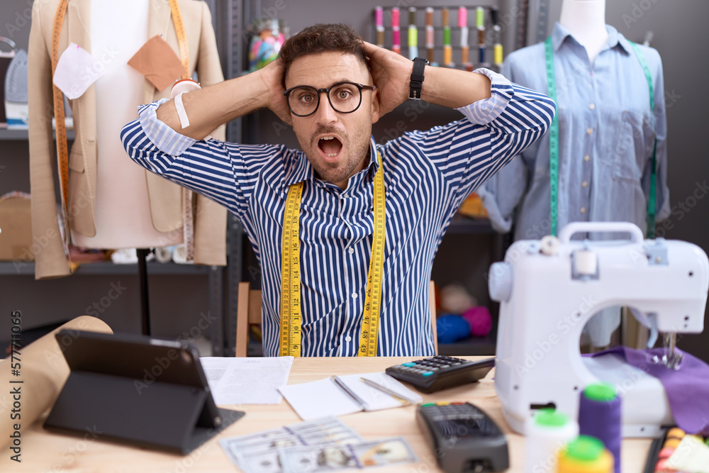 Hispanic man with beard dressmaker designer working at atelier crazy ...