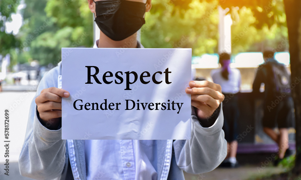 Foto de Stock Asian boy in school uniform holds white paper which has ...
