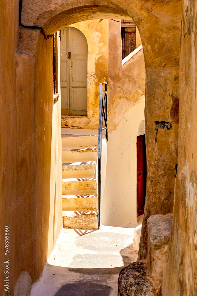 In the narrow streets of Emporio village, Santorini, Greece. The ...