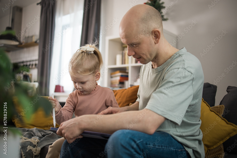 Deaf child girl with cochlear implant studying to hear sounds and have ...