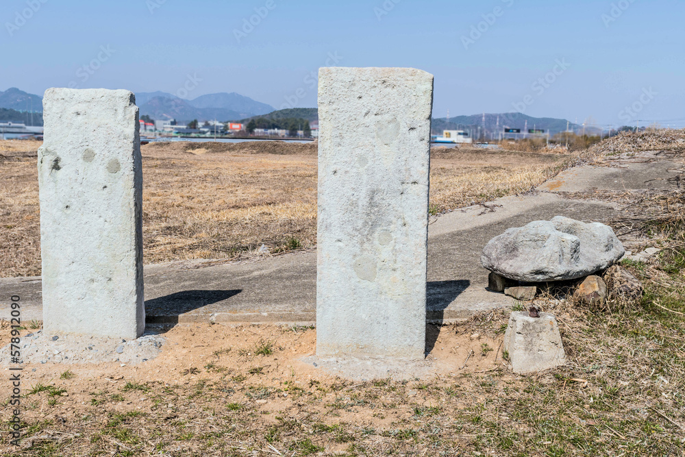 Two vertical slabs of cut stone, ruins of exterior wall of stone ...