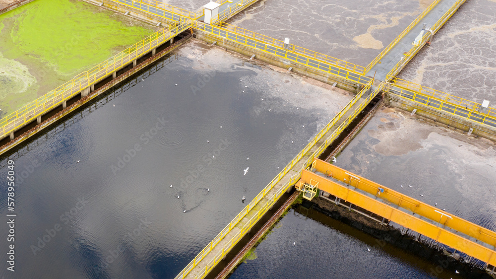 Aerial closeup of rectangular tanks of a sewage and water treatment ...