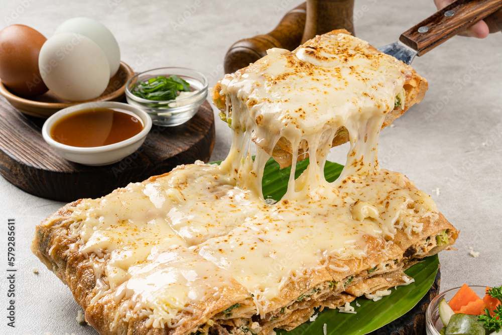 Martabak telur is indonesian street food, made with savory pan fried ...