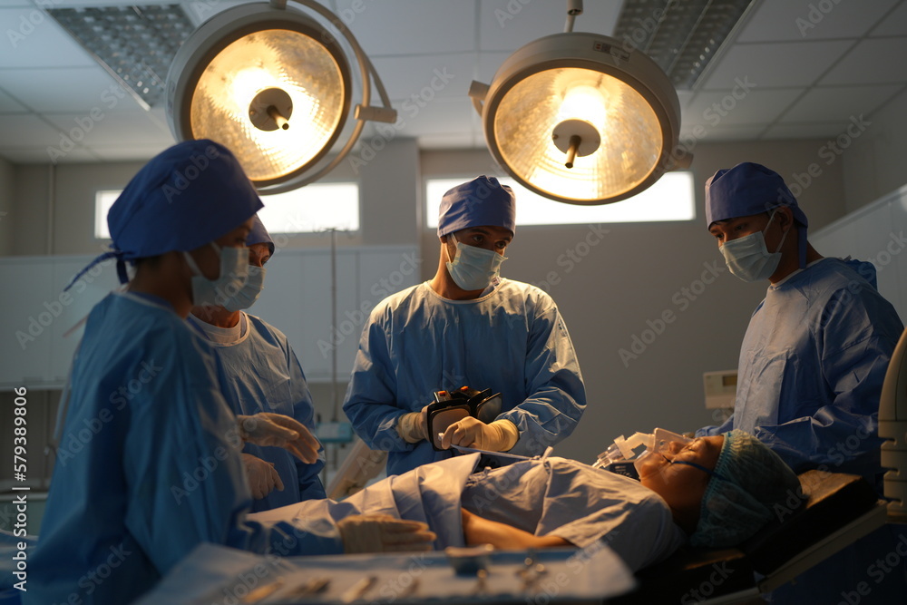 Medical Team Performing Surgical Operation in Modern Operating Room ...
