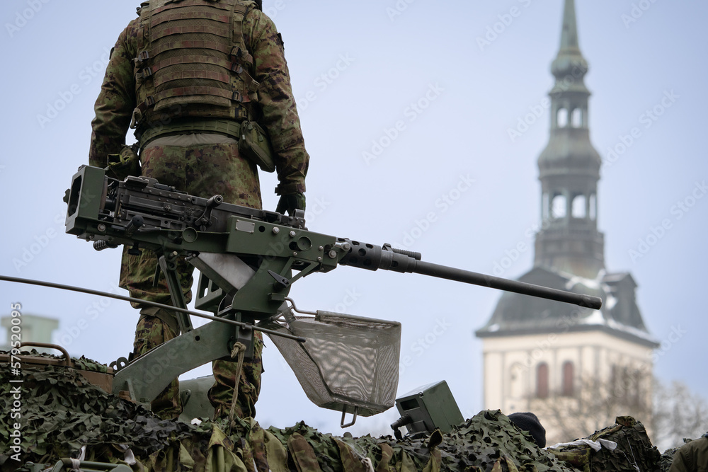 Estonian military soldier on an armored personnel carrier with a heavy ...