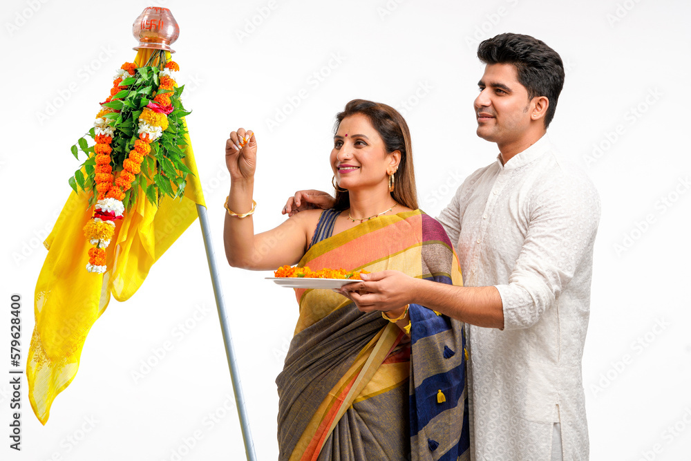 Indian Couple performing or celebrating Gudi Padwa Puja. celebrating ...