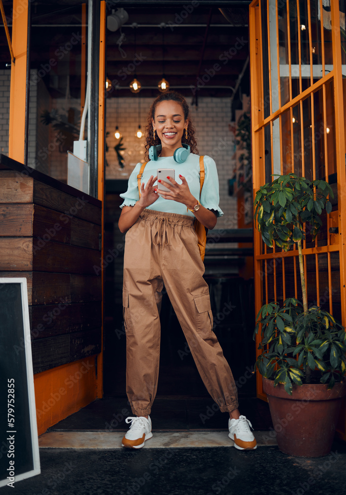 Cafe, student and phone social media with headphones on walk commute ...