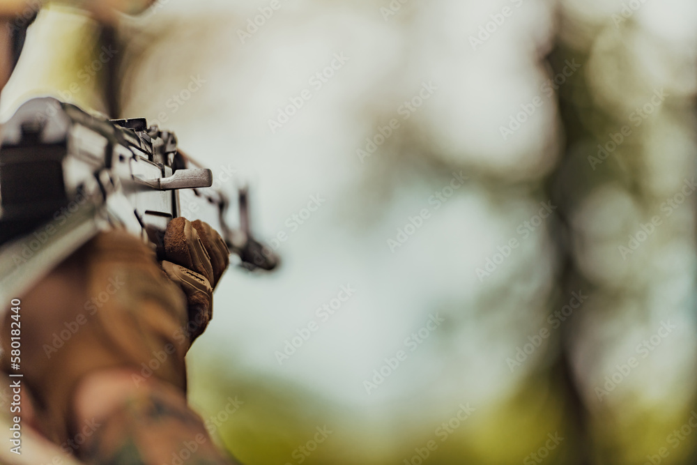 A modern warfare soldier on war duty in dense and dangerous forest ...