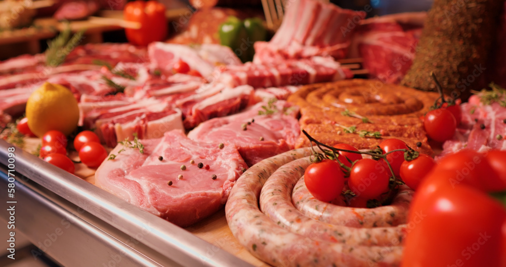 Delicious meat table layout raw steaks and sausages. Premium organic ...
