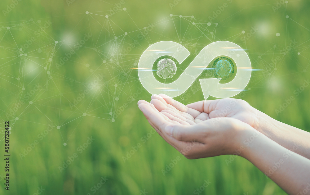 Human hand showing Arrow Infinity symbol with two globes of different ...