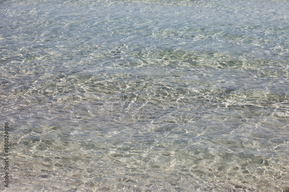 Shallow water texture, transparent sea surface with waves and sandy ...