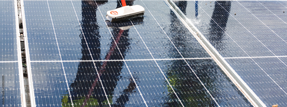 Solar roof cleaning concept, Professional technicians were washing and ...