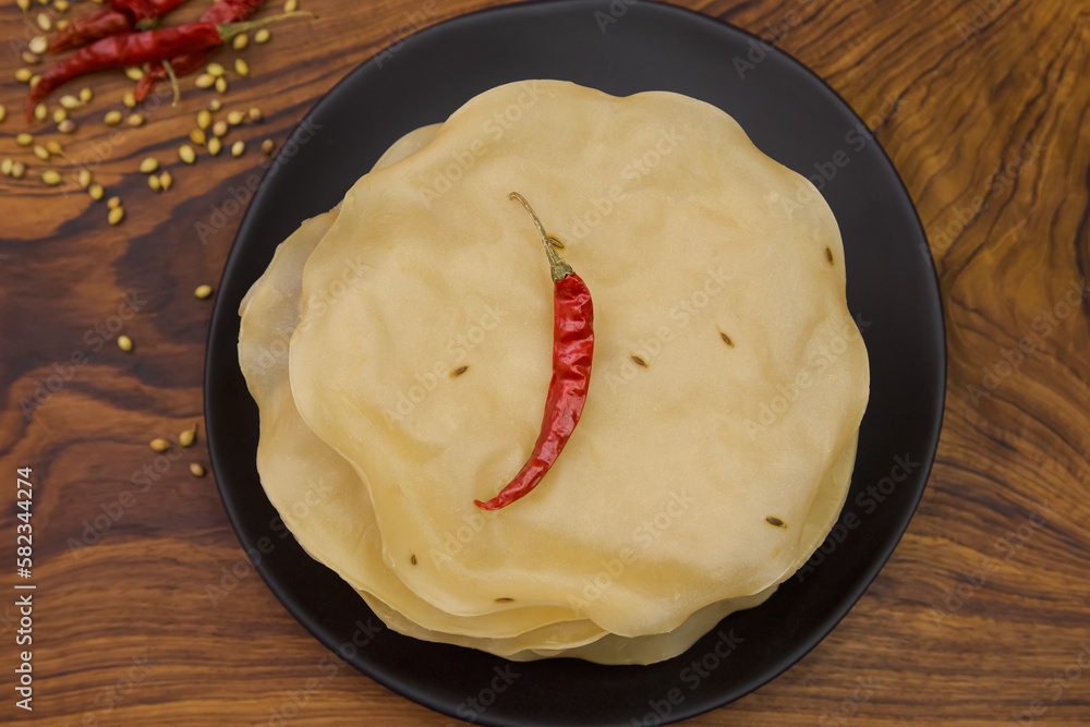 Papad, Khichiya papad, Rice papad isolated on wooden background. Top ...