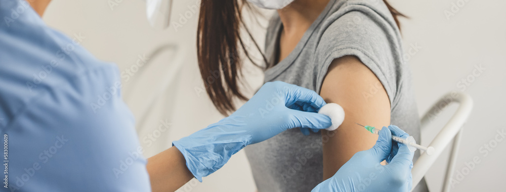 People getting a vaccination to prevent pandemic concept. Woman in ...