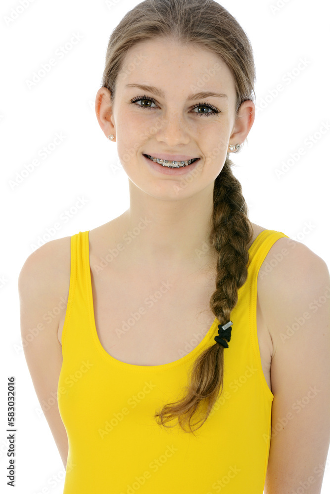 Portrait of a teenage girl wearing yellow one piece swimsuit in in ...