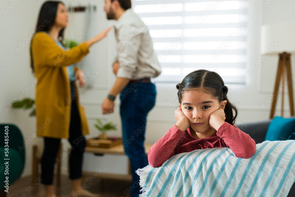 Sad little girl upset about their angry parents Stock Photo | Adobe Stock