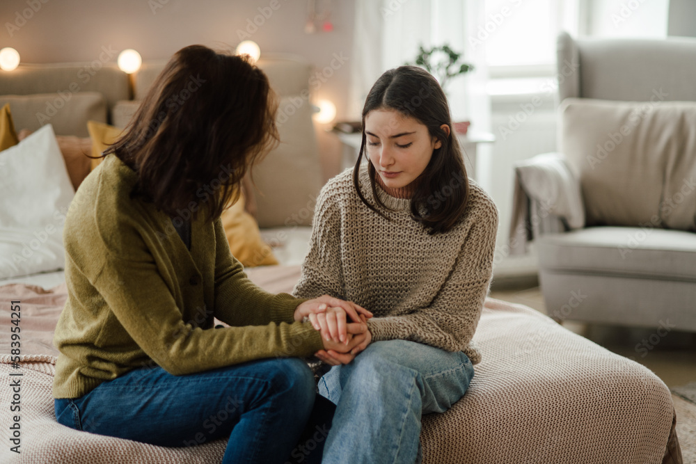 Teenage girl sharing problems with her mother. Stock Photo | Adobe Stock