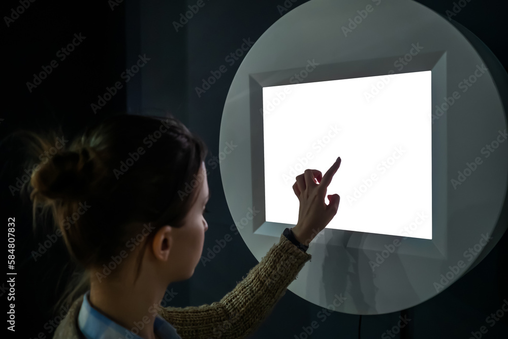 Woman hand using white blank interactive touchscreen display of ...