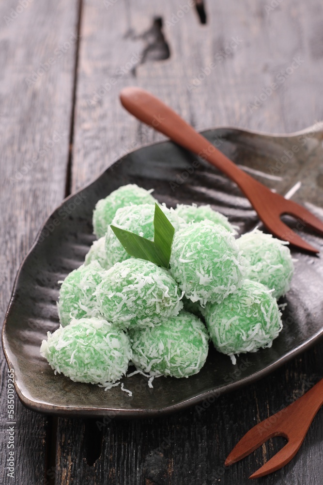 Klepon or kelepon, is a snack of sweet rice cake balls filled with ...