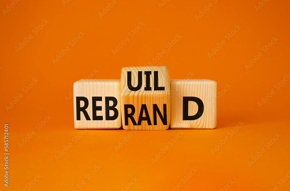 Rebuild and Rebrand symbol. Turned wooden cubes with words Rebrand and ...