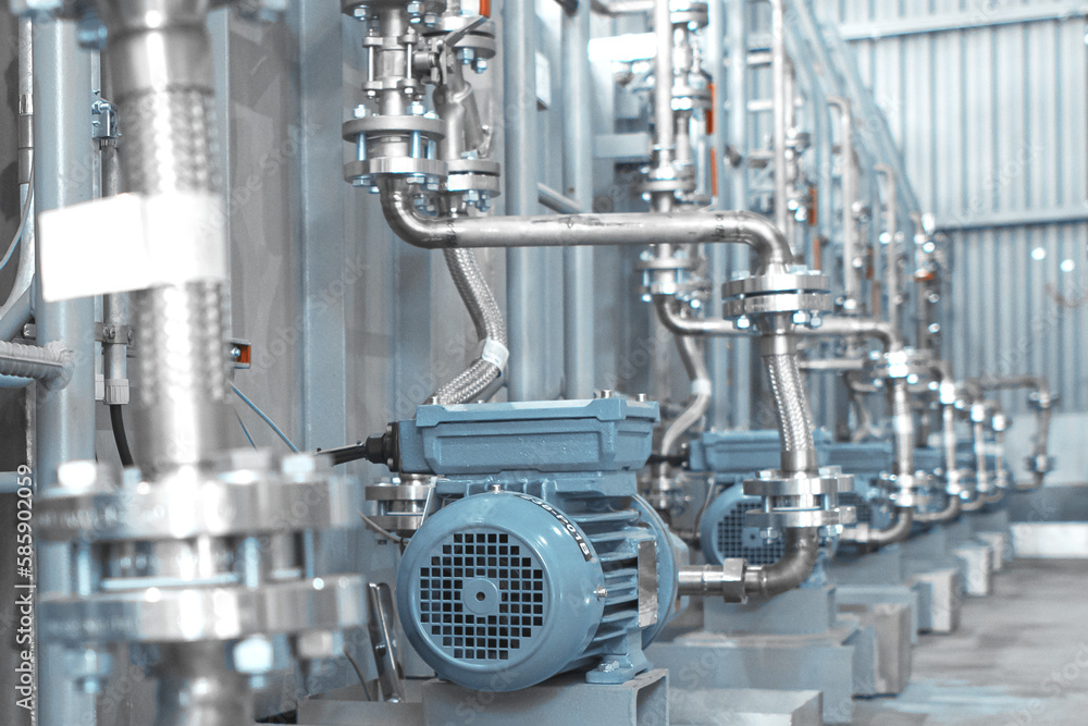 Industrial equipment. Detail of new blue electric motors with pumps on ...