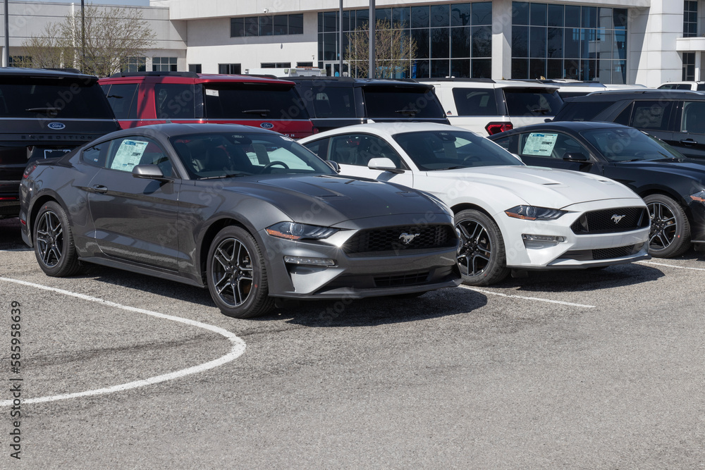 Ford Mustang display at a dealership. Ford offers the Mustang in a base ...