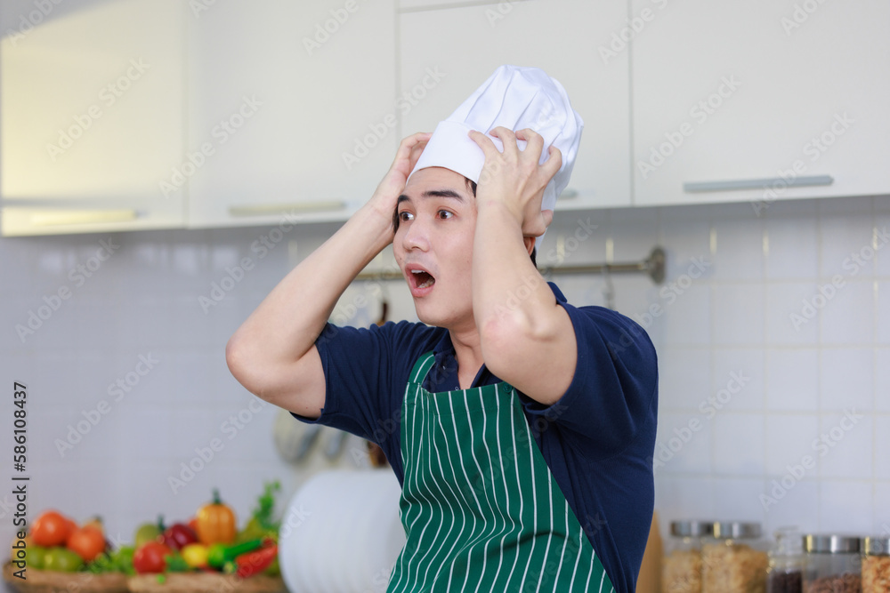 Millennial Asian excited shocked worried frightened stressed male chef ...