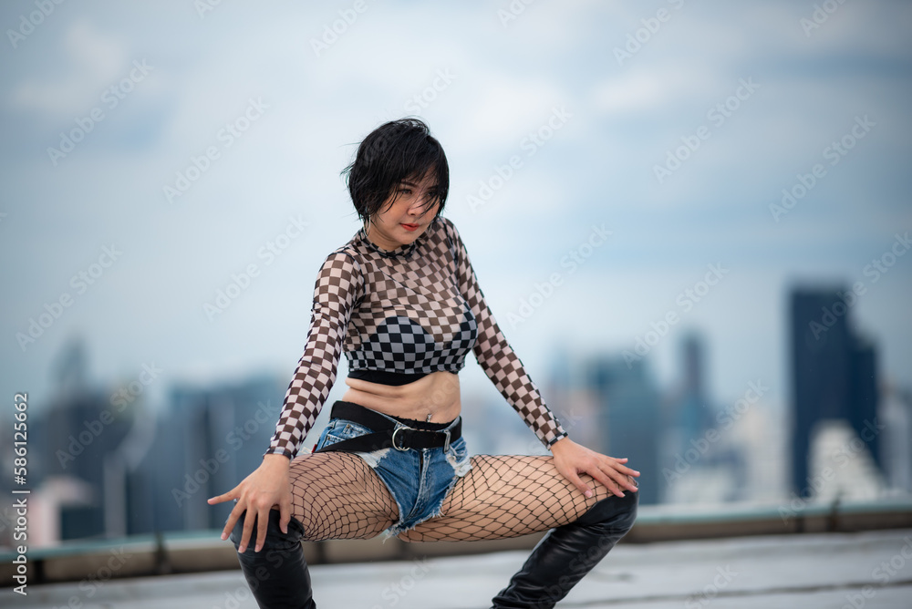 Beautiful Asian female hip hop dancer striking a sexy dance pose, attractive sexy dancer women ...