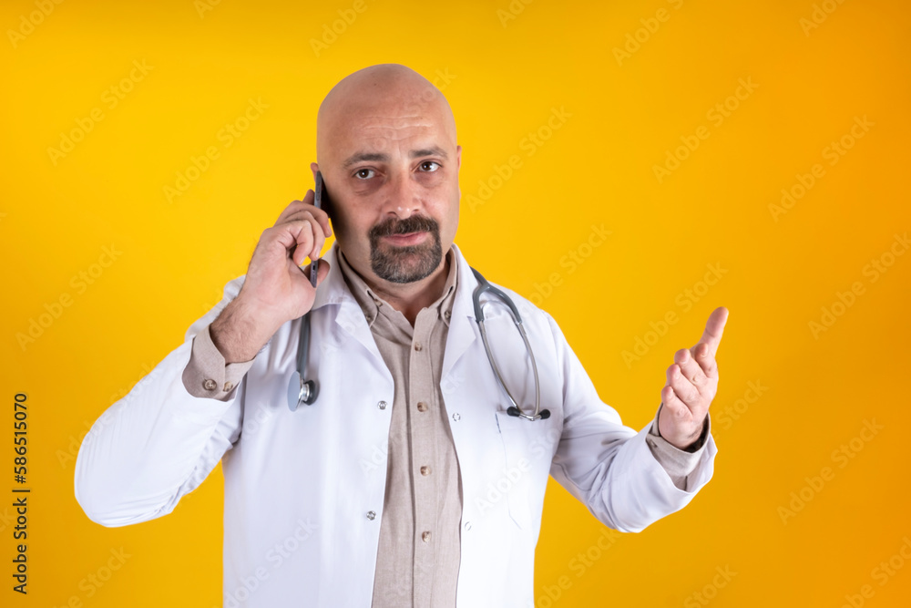 Angry doctor, middle aged caucasian angry doctor on the phone. Portrait ...