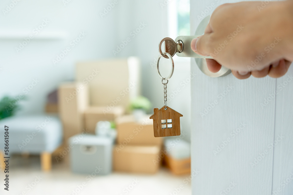 Foto Moving house, relocation. The key was inserted into the door of ...