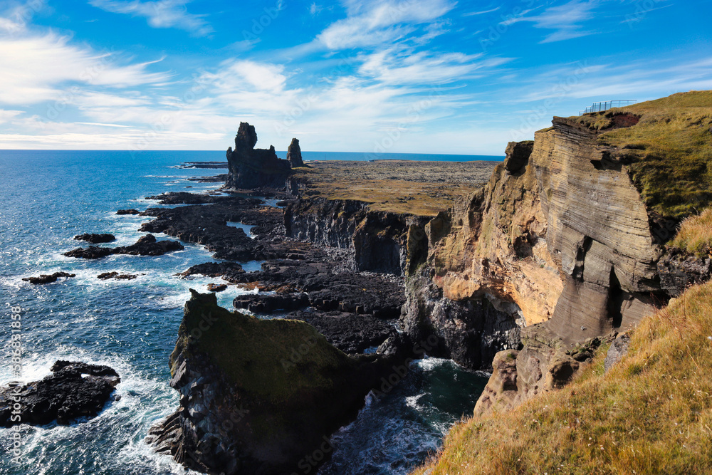 Dramatic cliffs along the Icelandic coastline, with jagged rock ...