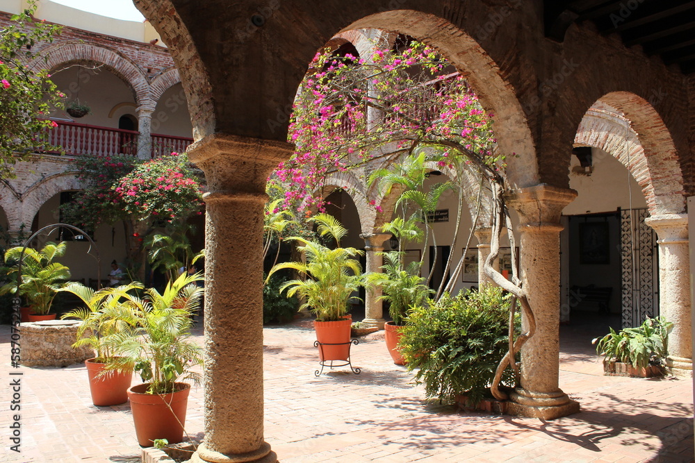 Interior square courtyard with trees, flowers, arches Convent (Convento ...