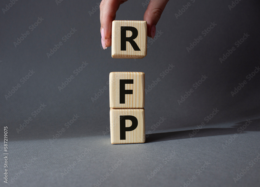 RFP - Request for Proposal. Wooden cubes with word RFP. Businessman ...