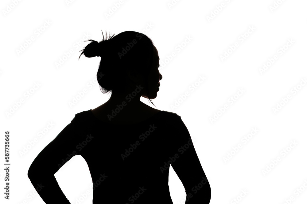 Black backlit silhouette of head and shoulders of an oriental woman ...