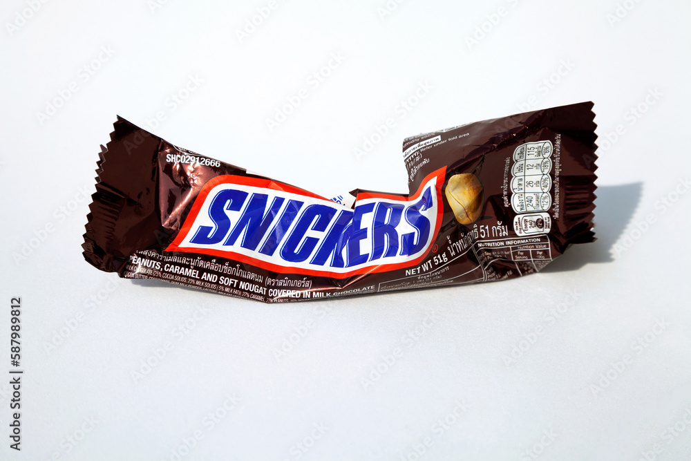 Ho Chi Minh City, Vietnam - March 28, 2023: Snickers chocolate bar empty crumpled wrapper ...