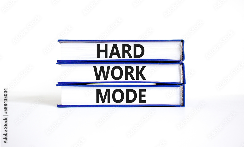 Hard work mode symbol. Concept words Hard work mode on books on a ...