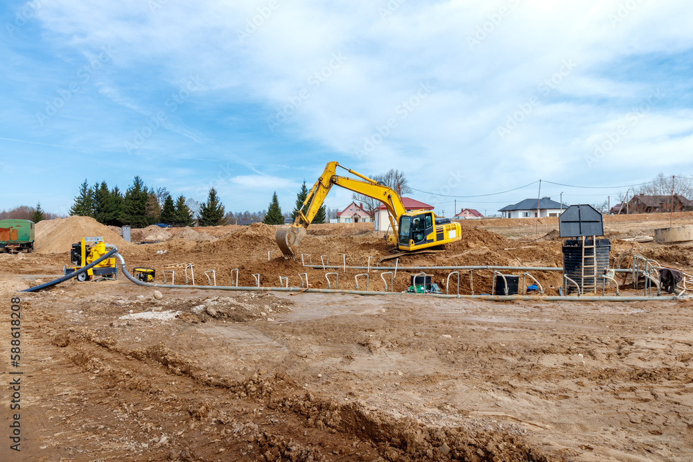 Excavator dig the trenches at a construction site. Trench for laying ...