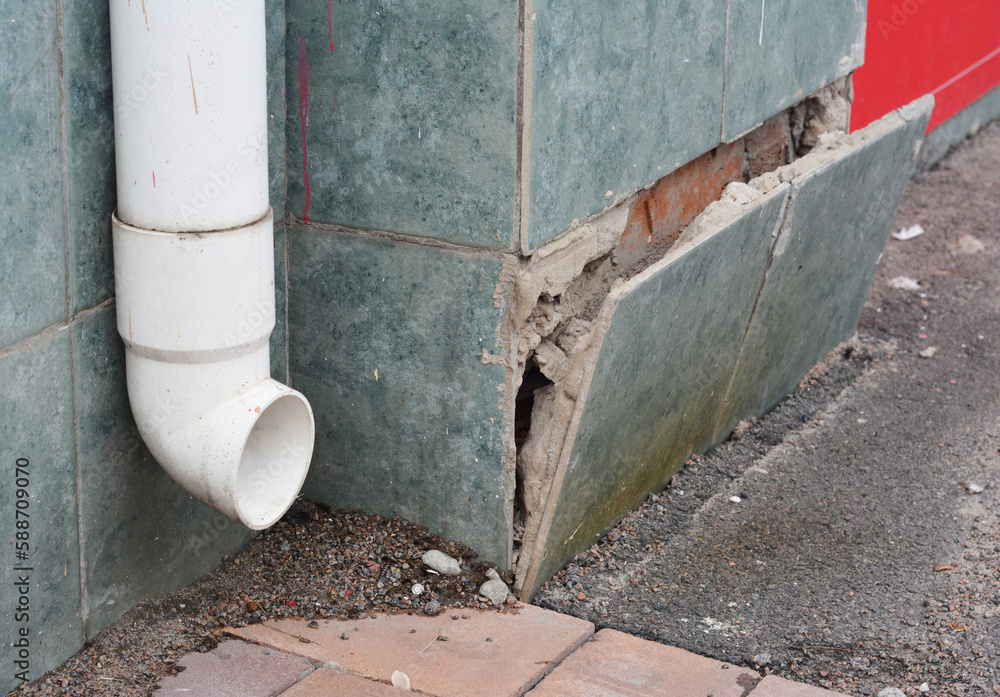 House foundation facing with ceramic tiles. House foundation repair ...