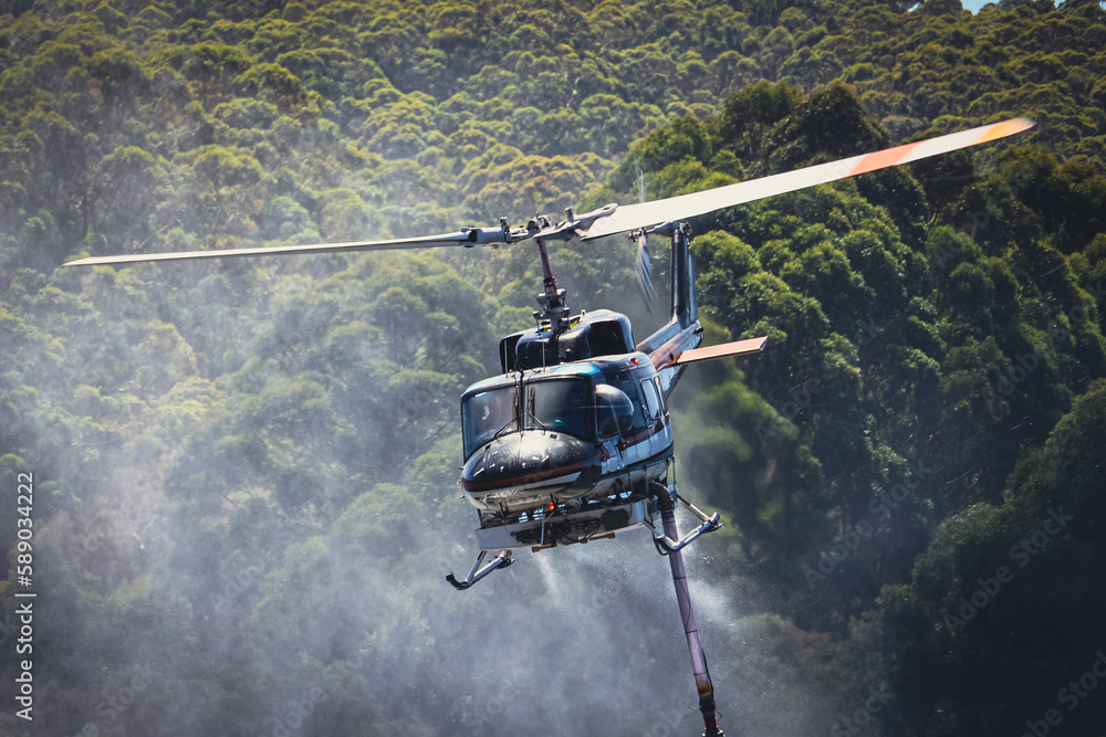 Blackhawk Fire and Rescue Helicopter. Helicopter siphoning water from a ...