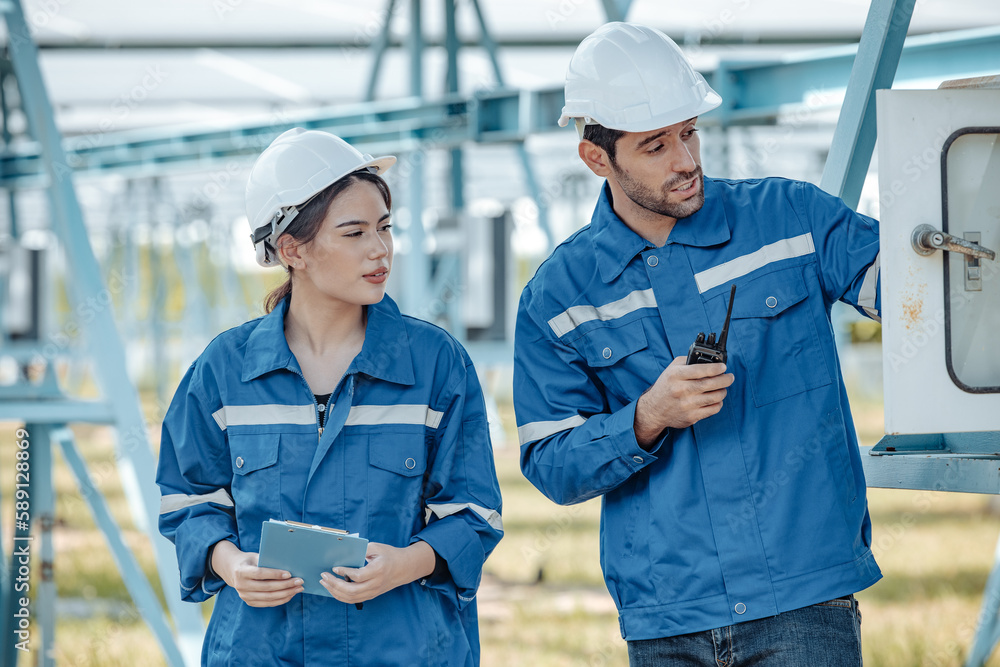 Solar electric installer and practitioner inspect electrical systems ...
