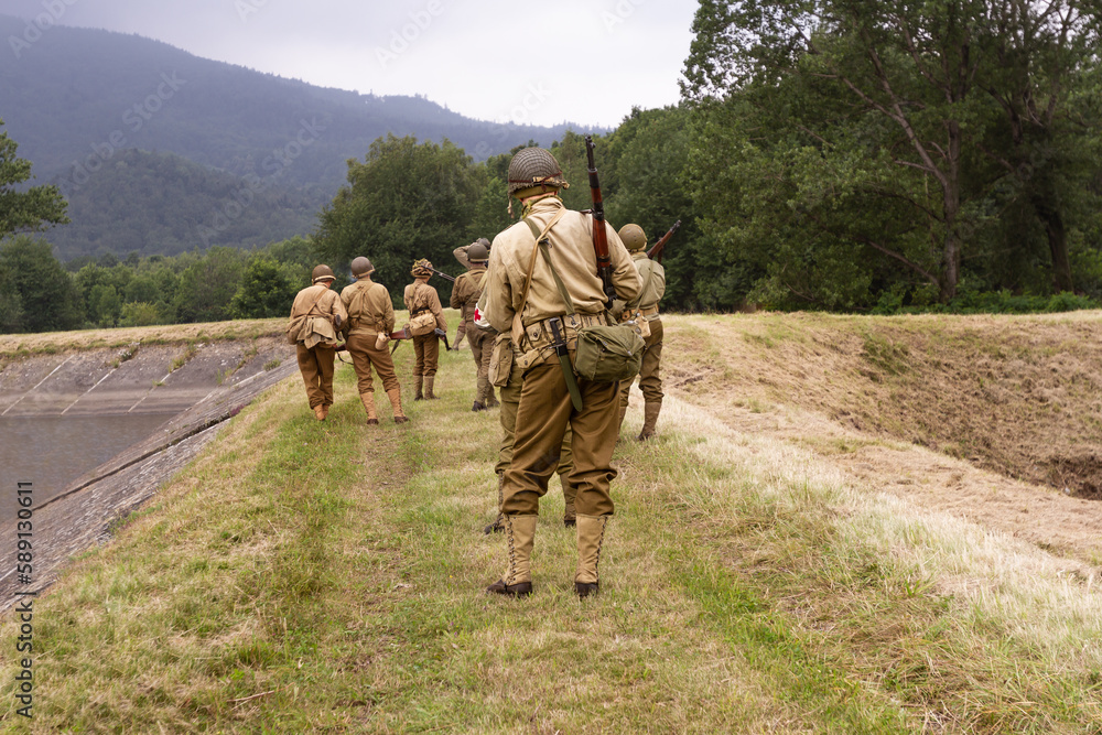Historical reconstruction. World War II infantry division soldiers ...