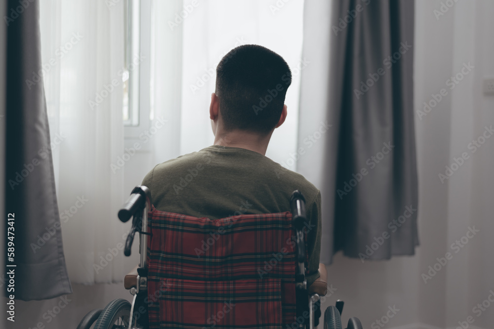 Young man with disability sitting think alone,Teenager boy looking ...