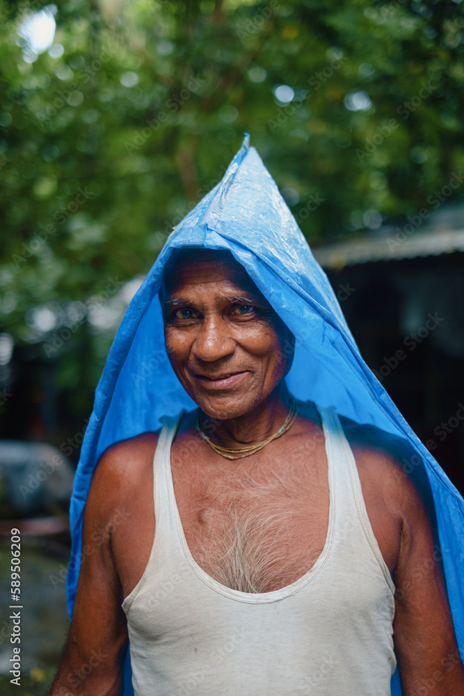 Portrait of a south asian elderly village farmer wearing traditional ...